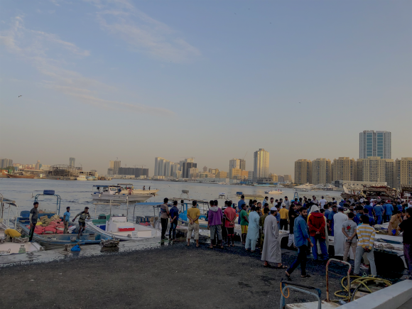 Ajman Fish Market Filipina having fun and buying the local way